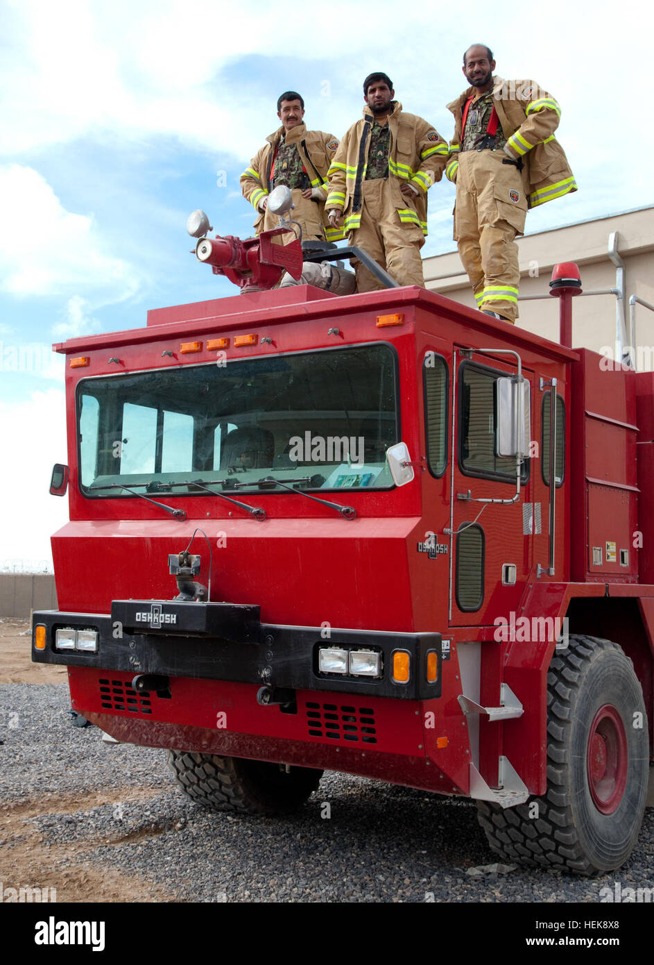 Afghan National Army Air Force firemen pose on top of their truck at ...