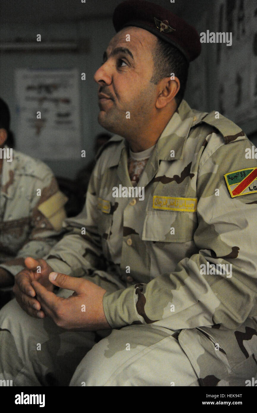 An Iraqi army soldier asks a question to U.S. Army Spc. Kayla Hammonds ...