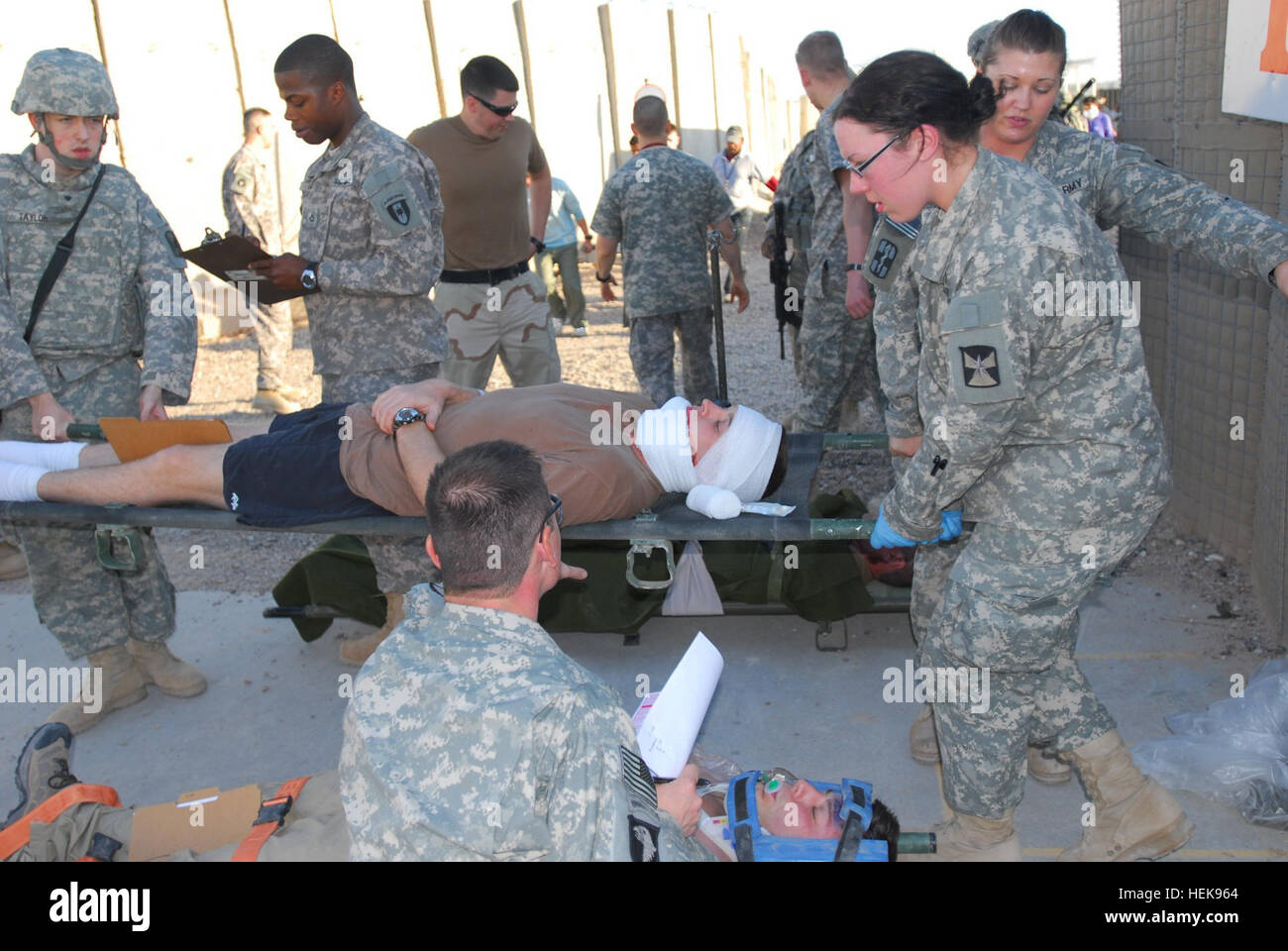 Medical personnel prepare to move a patient into COB Basra Hospital as ...