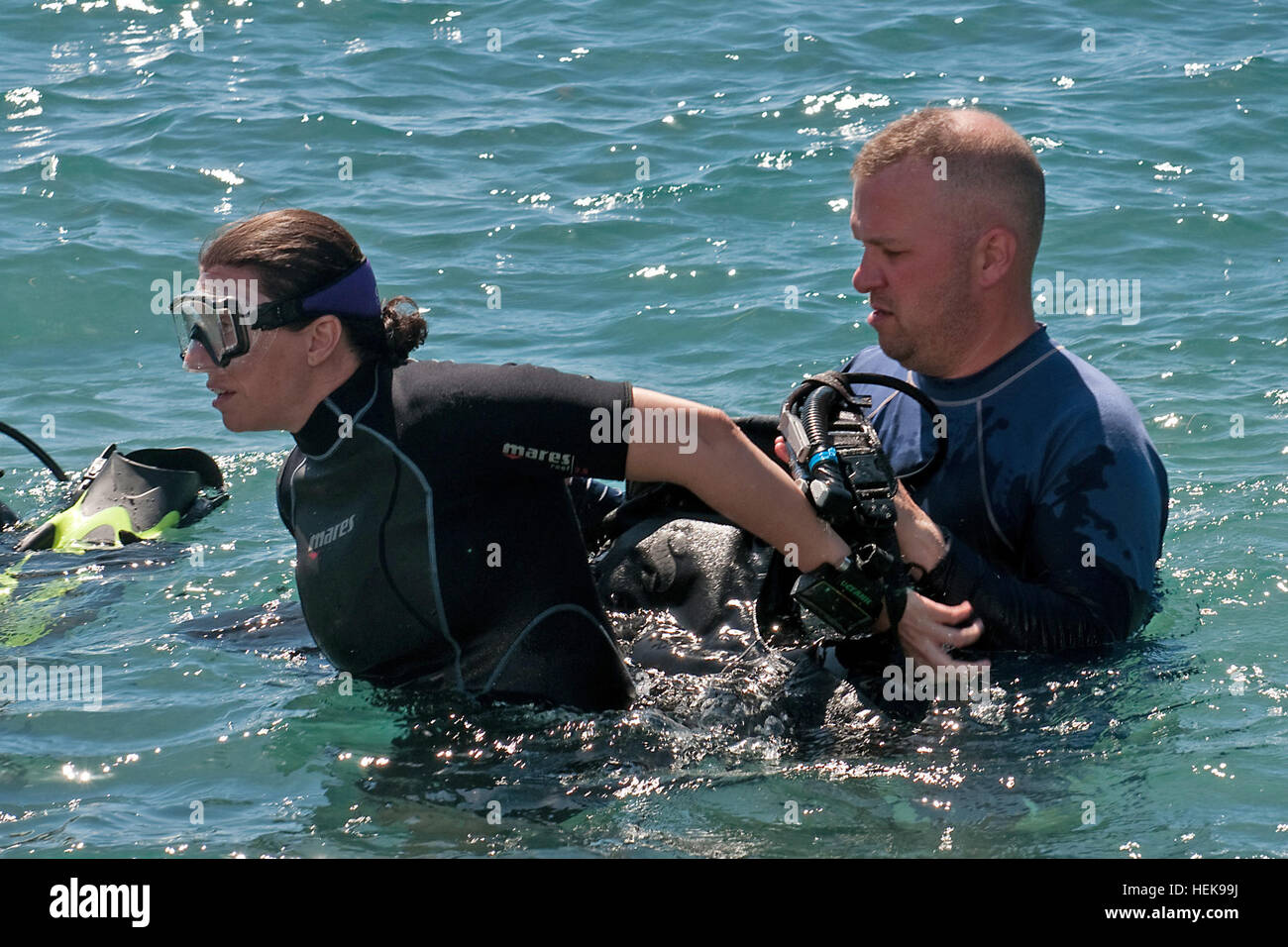 GUANTANAMO BAY, Cuba -- Army Staff Sgt. Stefanie Mason is assisted into ...