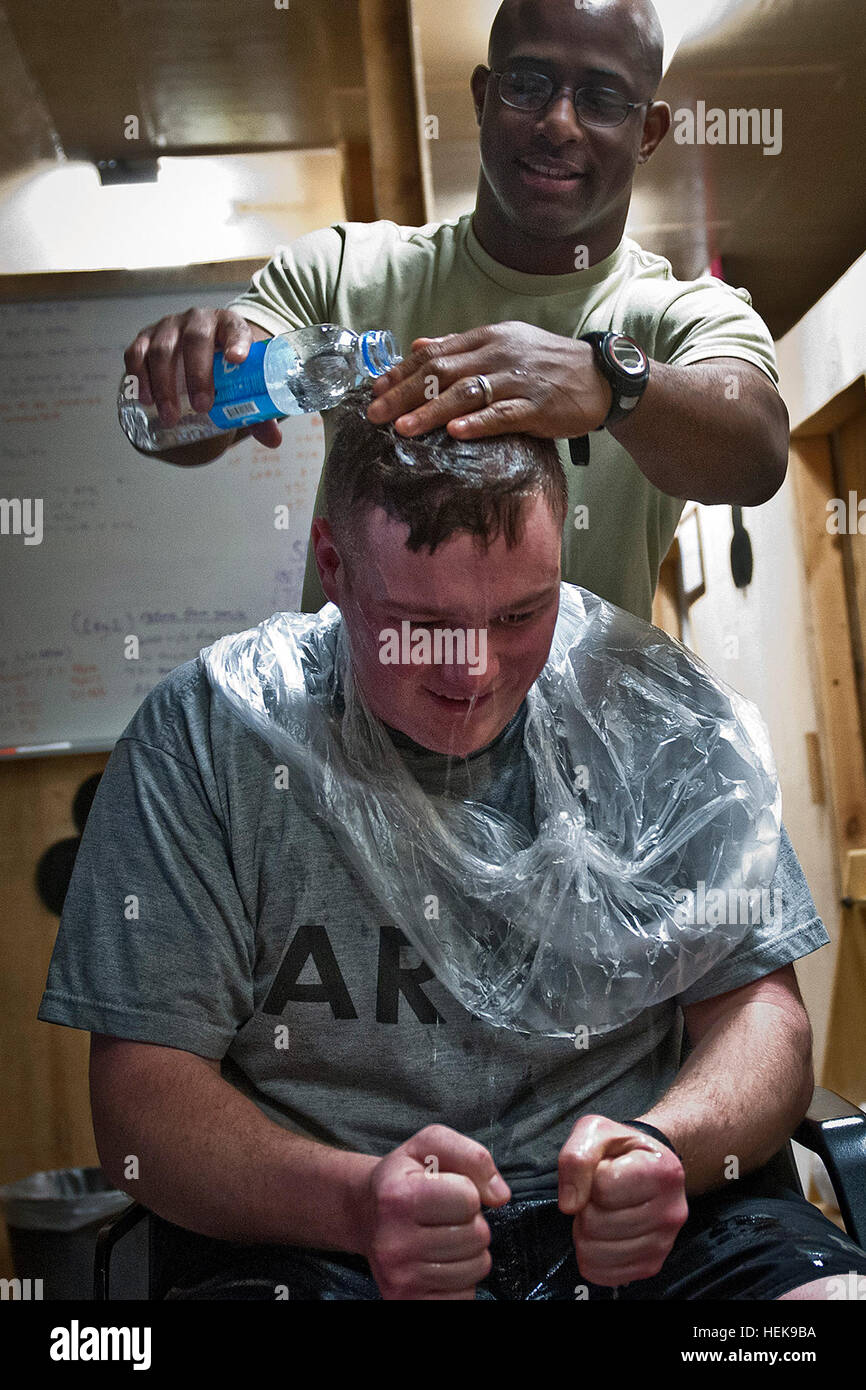 First Sgt. Corey M. Towns from Fitzgerald, Ga., pours water on 1st Lt ...