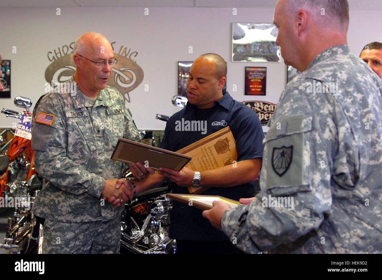 Brig. Gen. Jon. L. Trost gives a certificate of appreciation to Joe ...
