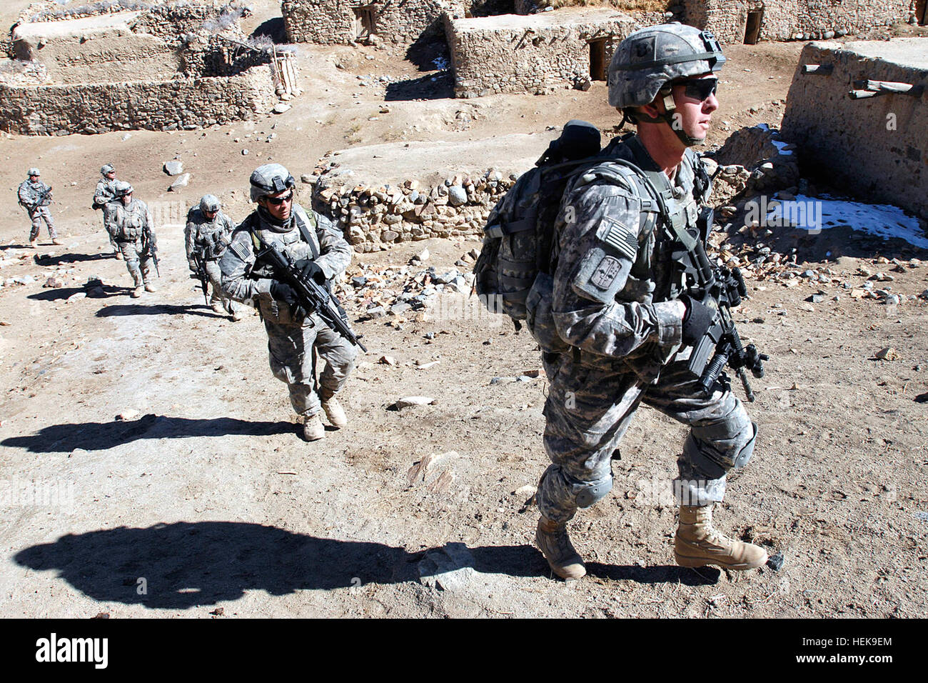 Soldiers with the 101st Airborne Division patrol a small village during ...