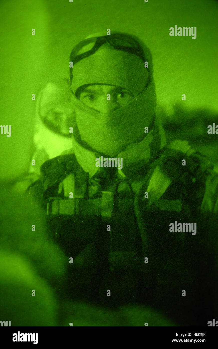 An Afghan National Army Commando from 3rd Commando Kandak listens to a ...