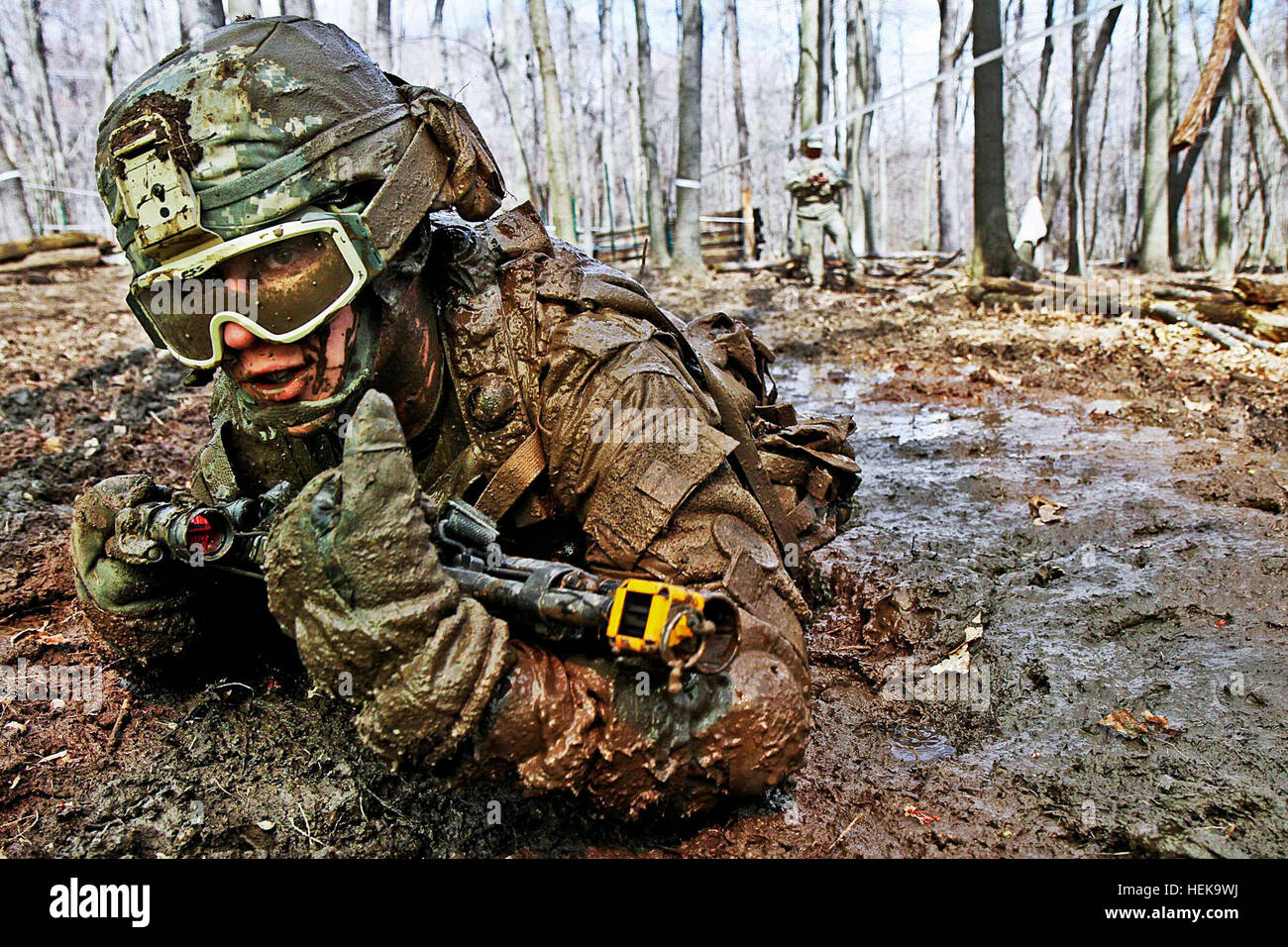 110417-A-5937M-004 U.S. Army Pvt. Charles Shidler crawls through mud ...