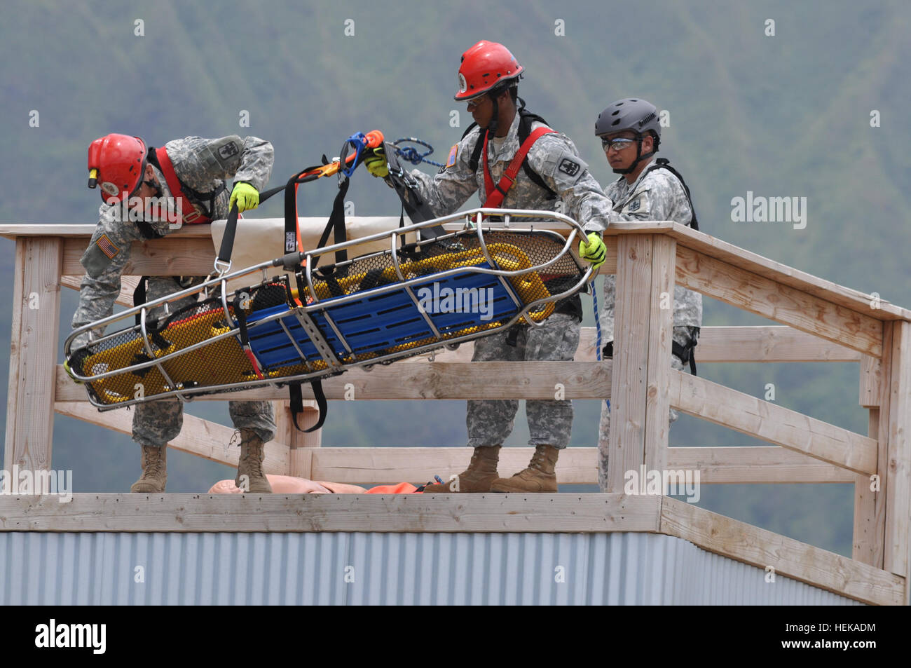 Members of the Hawaii Army National Guard prepare a litter for ...