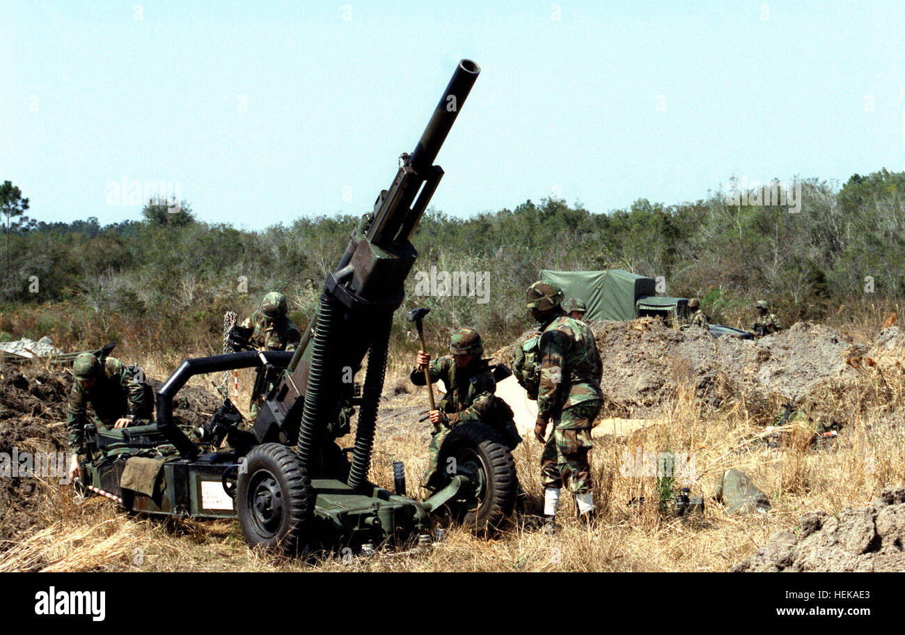 A member of a gun from the 82nd Airborne Division stakes down the ...