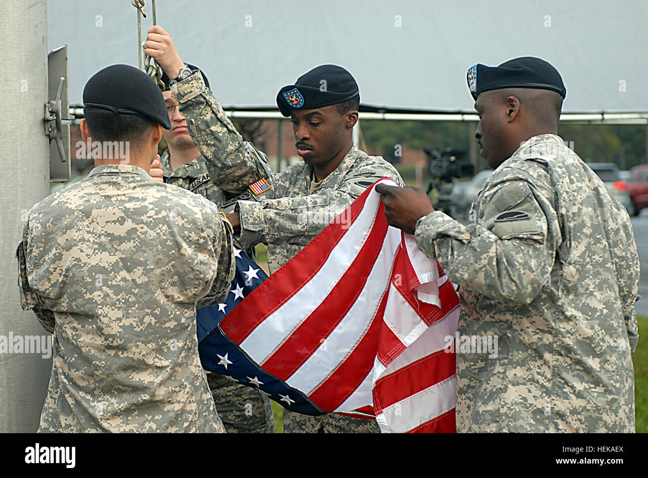 Soldiers of the 78th Division prepare their flag to be retired at the ...