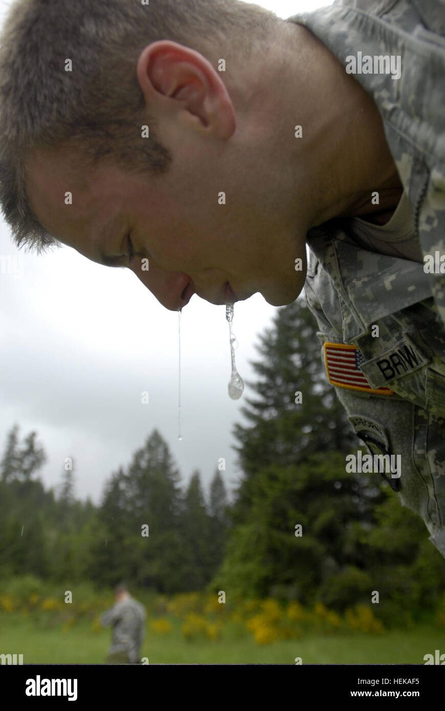 A U.S. Soldier spits after being exposed to tear gas during an M40 ...