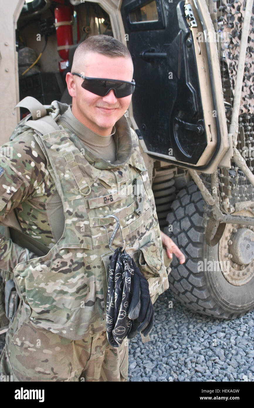 U.S. Army Spc. Tyler Parker-Bellinger, from Cedar Rapids, Iowa, a truck ...