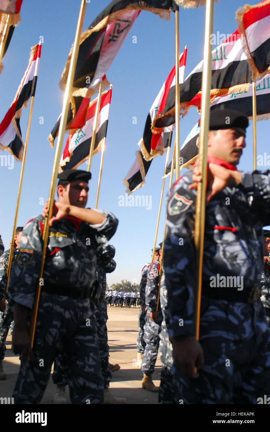 Kirkuk Iraqi police carry their nation's flag during the ceremony ...