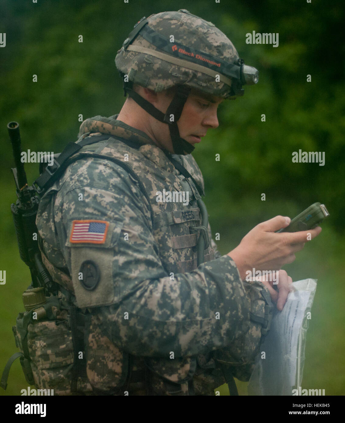 Staff Sgt. Max Rees checks his next waypoint on a Defense Advanced GPS ...