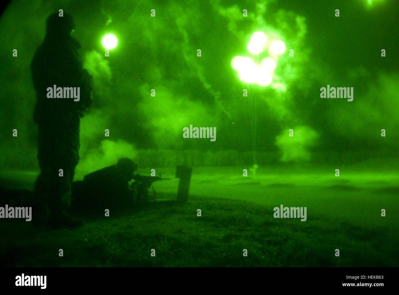 A safety looks on as Staff Sgt. Max Rees, 75th Training Division, gets ...