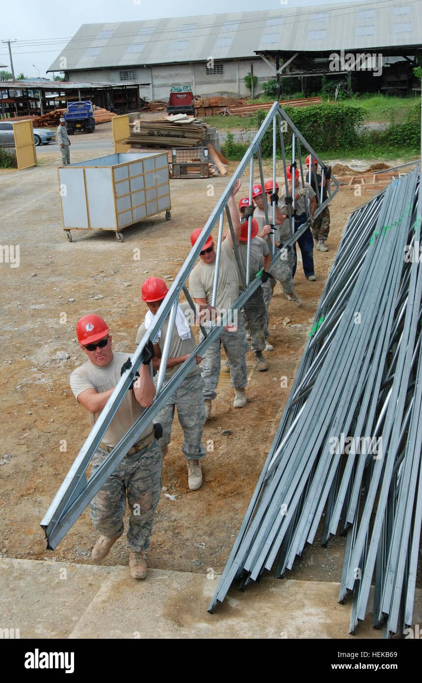 A team of U.S. airmen with the 555th and 820th Rapid Engineer ...