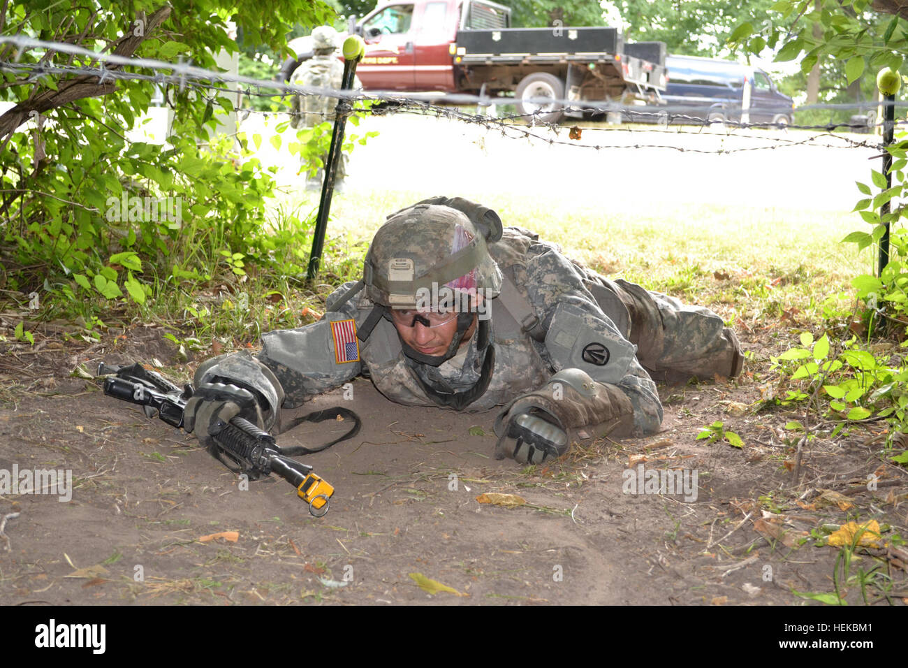 PFC Francisco Espino tackles one of several low-crawl obstacles during ...