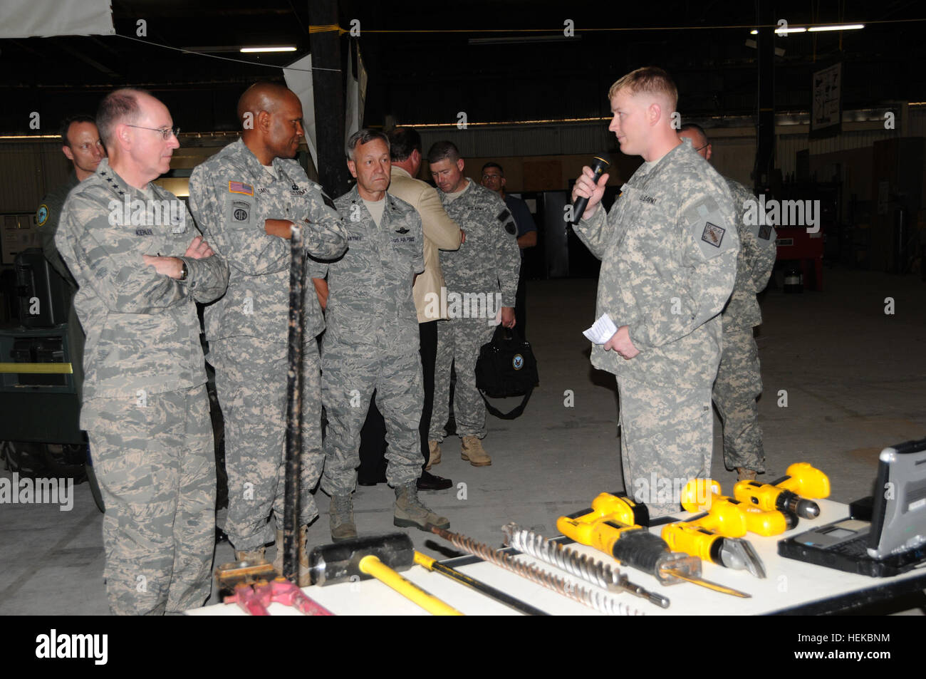 Sgt. Bret Stolle, 20th Support Command, spoke to visiting dignitaries ...