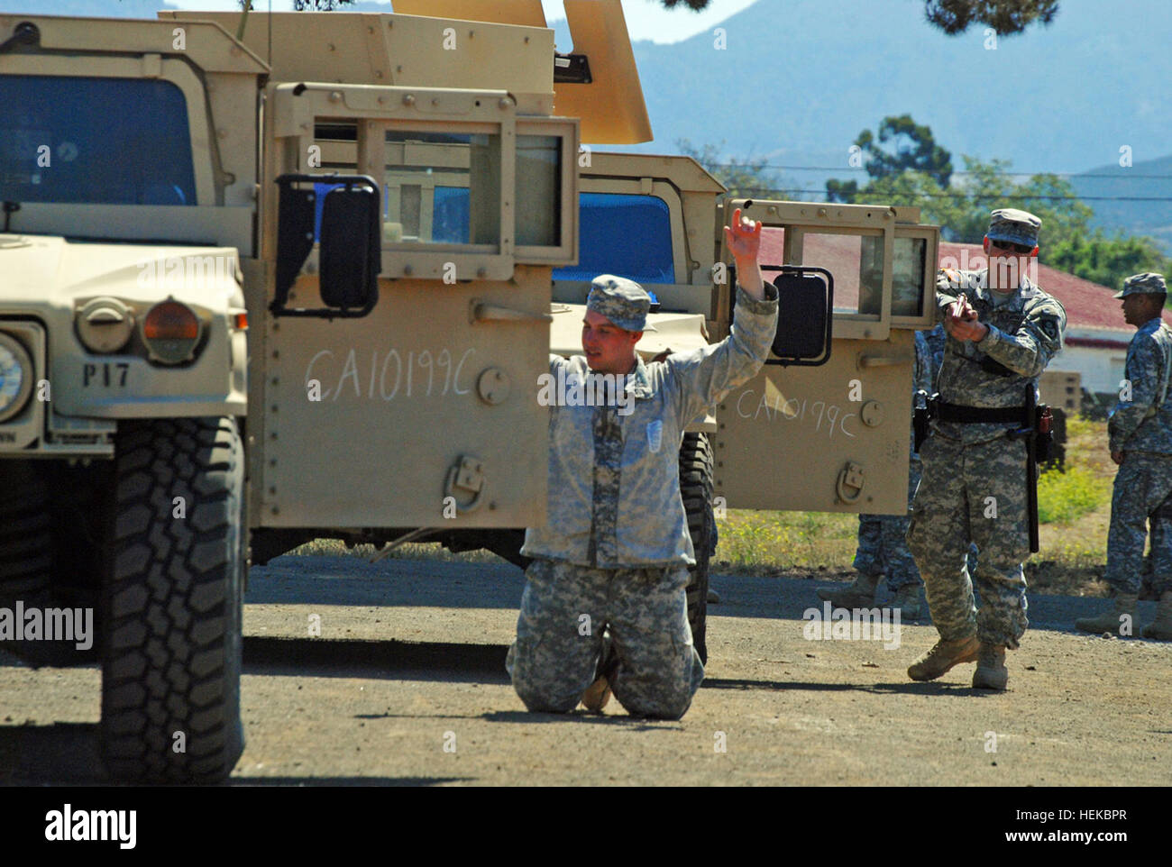 Spc. Kevin Valencia (right) of the 40th Military Police Company, 185th ...