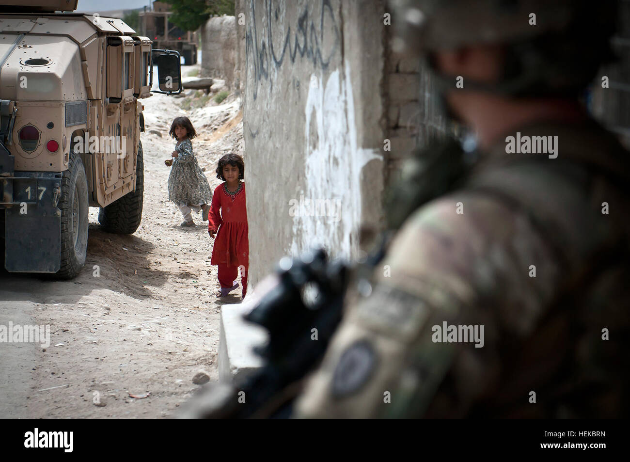 NANGARHAR PROVINCE, Afghanistan – Playful Afghan girls run to hide as U ...