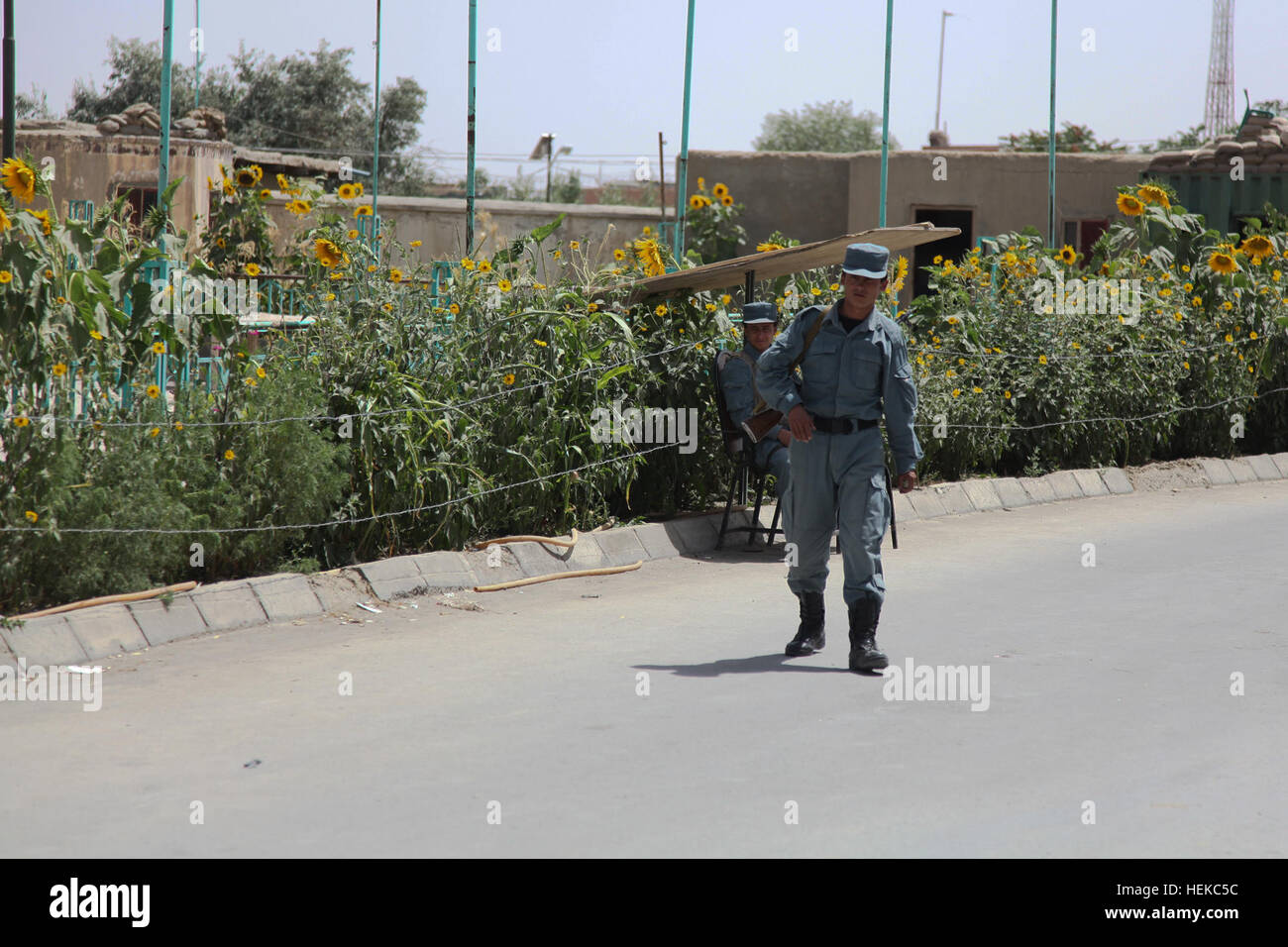 Two Afghan Uniformed Police watch a check point outside of Forward ...
