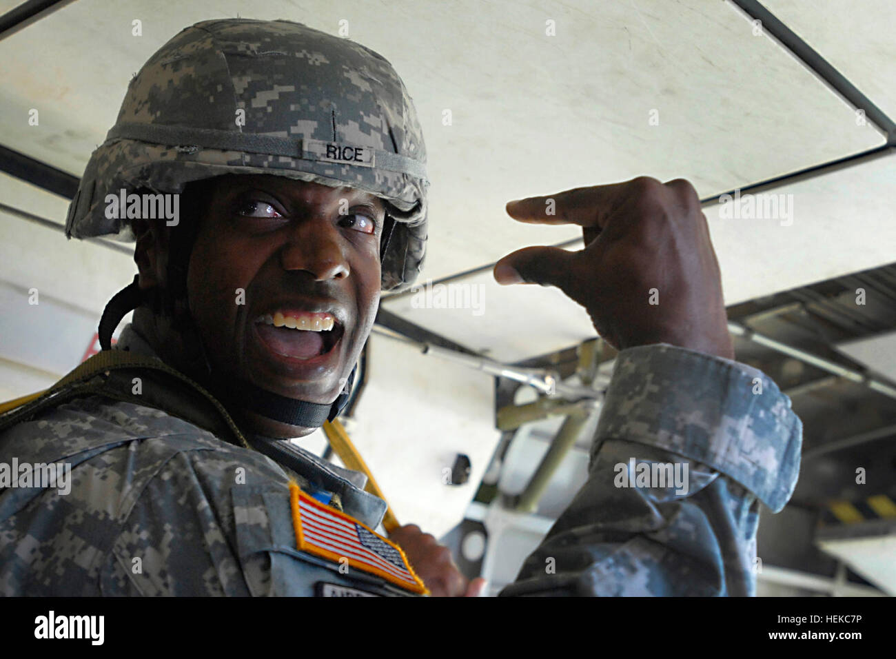 110802-A-FS865-053 Army Master Sgt. Sean Rice gives the hand signal for ...