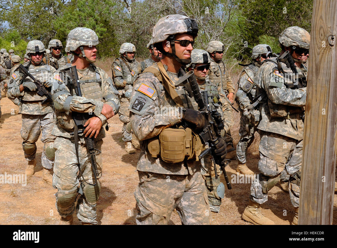 Soldiers from Task Force Raptor (3-124) move from lane to lane in ...