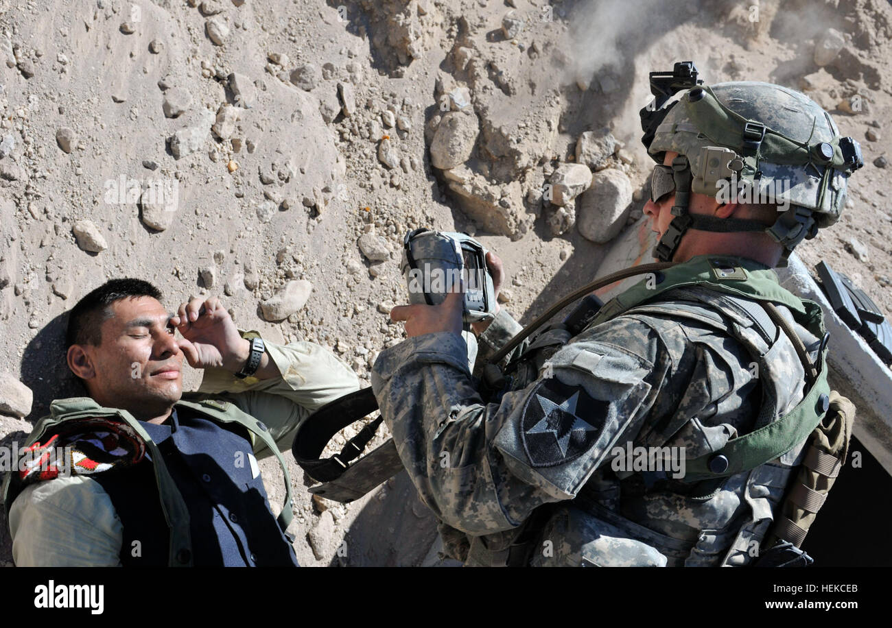 A U.S. Army Soldier conducts biometric scanning of insurgents using ...