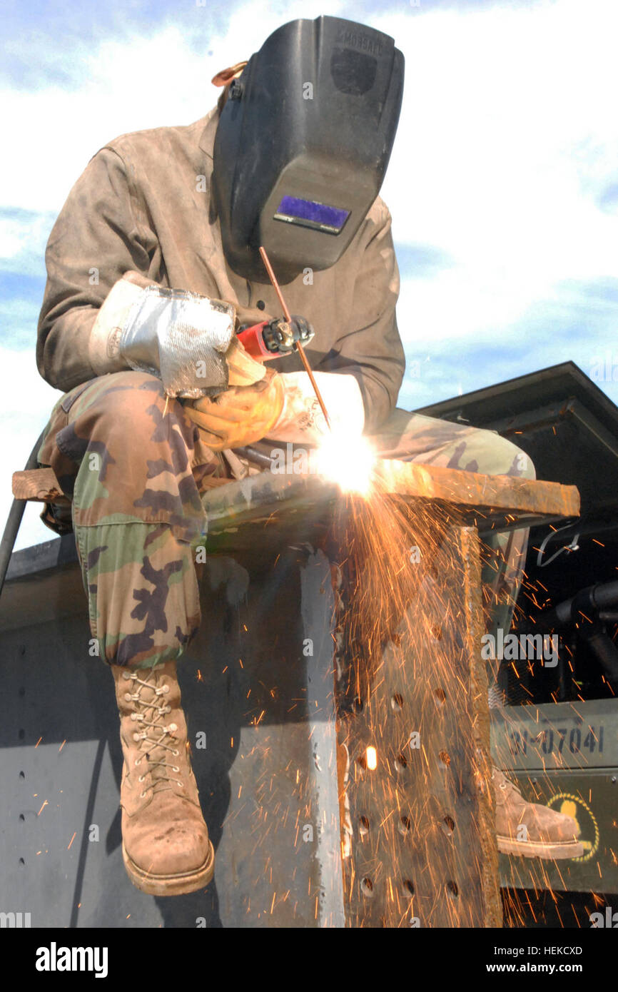 Navy Petty Officers 3rd Class Robert Bartlett and Matthew Long, steel ...
