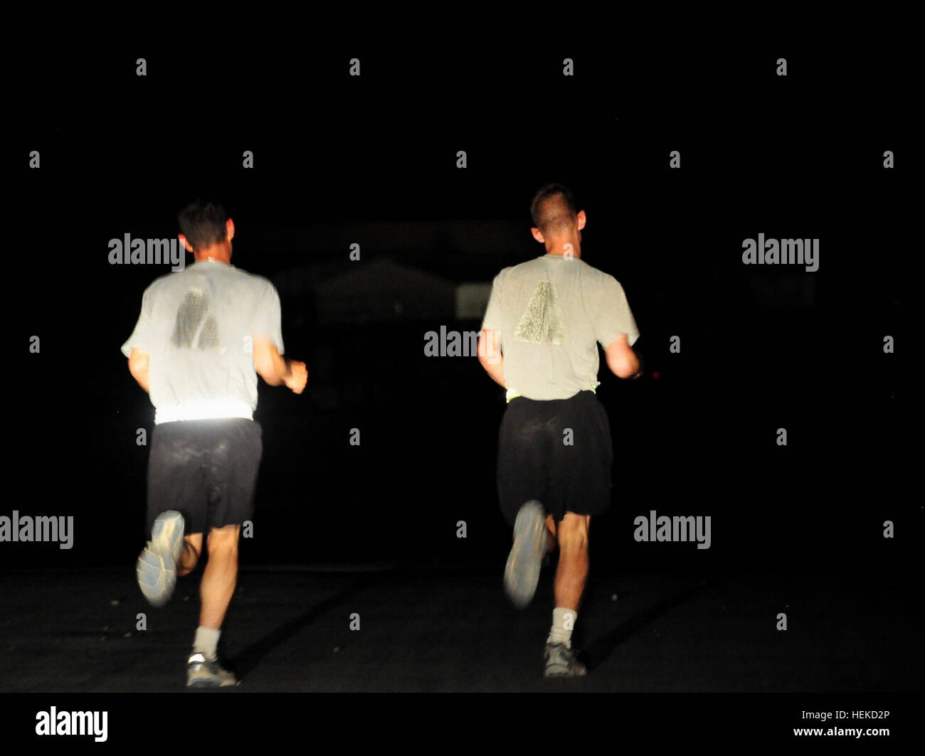 Spc. Alexander Polley runs alongside his father, Command Sgt. Maj ...