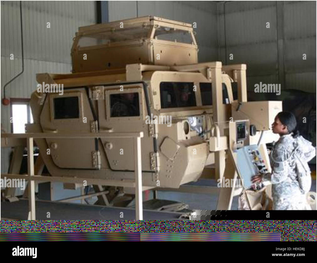 U.S. Soldiers ride inside a Humvee Egress Assistance Trainer during ...