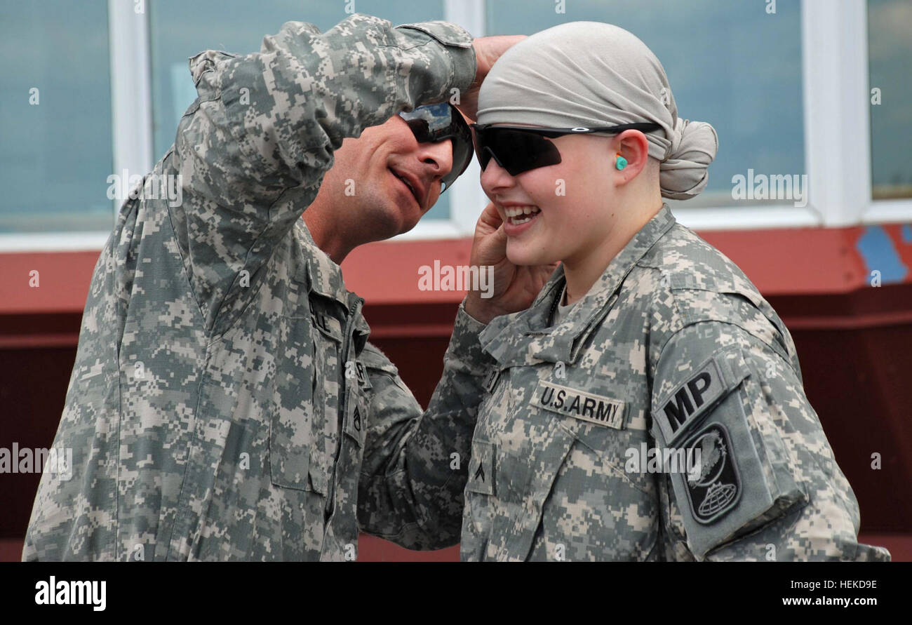Staff Sgt. Dean Vandall, Alaska Army National Guard, helps his sister ...