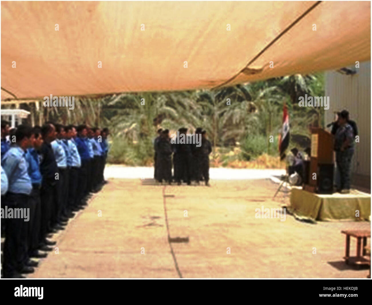 New Iraqi Policemen, left, stand in formation with their trainers ...