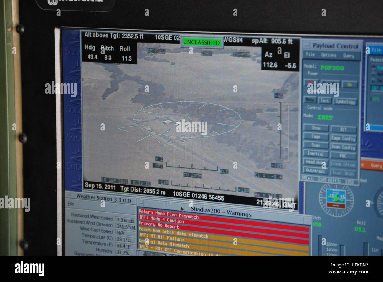 A monitor displays an image of McMillan Airfield as seen from one of ...