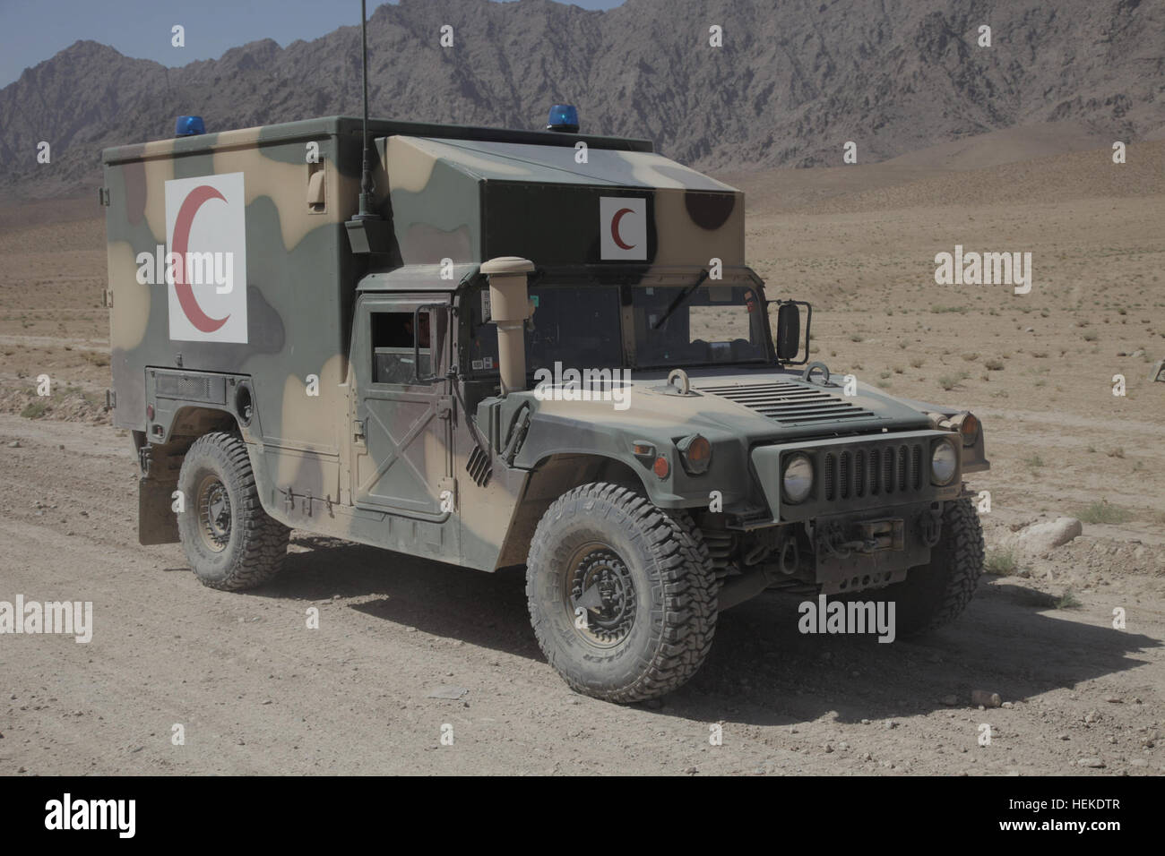 An Afghan Red Crescent Society Humvee is parked as U.S. Soldiers ...