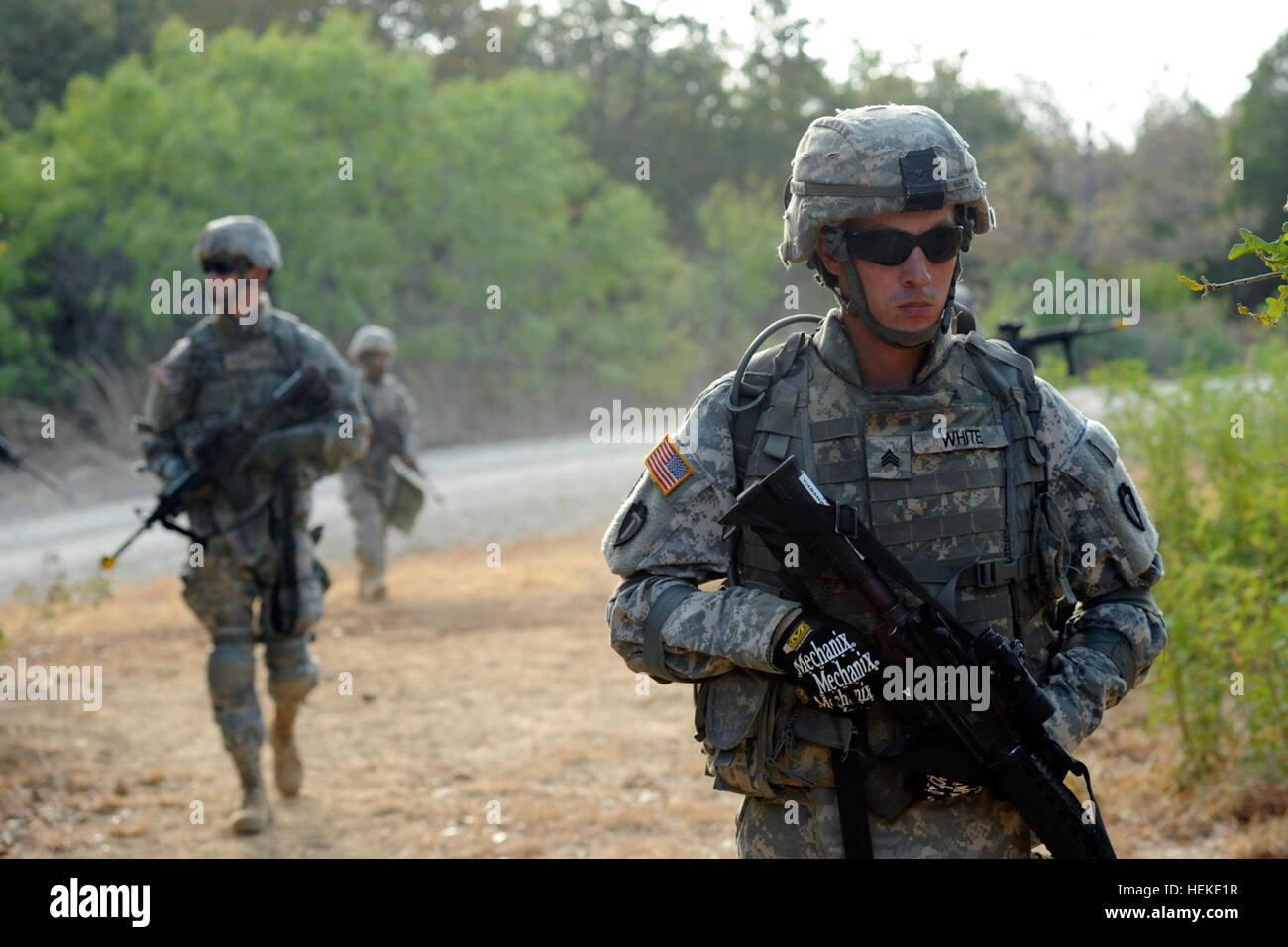 Sgt. Joshua White from Alpha Troop, Task Force Raptor (3-124), scans ...