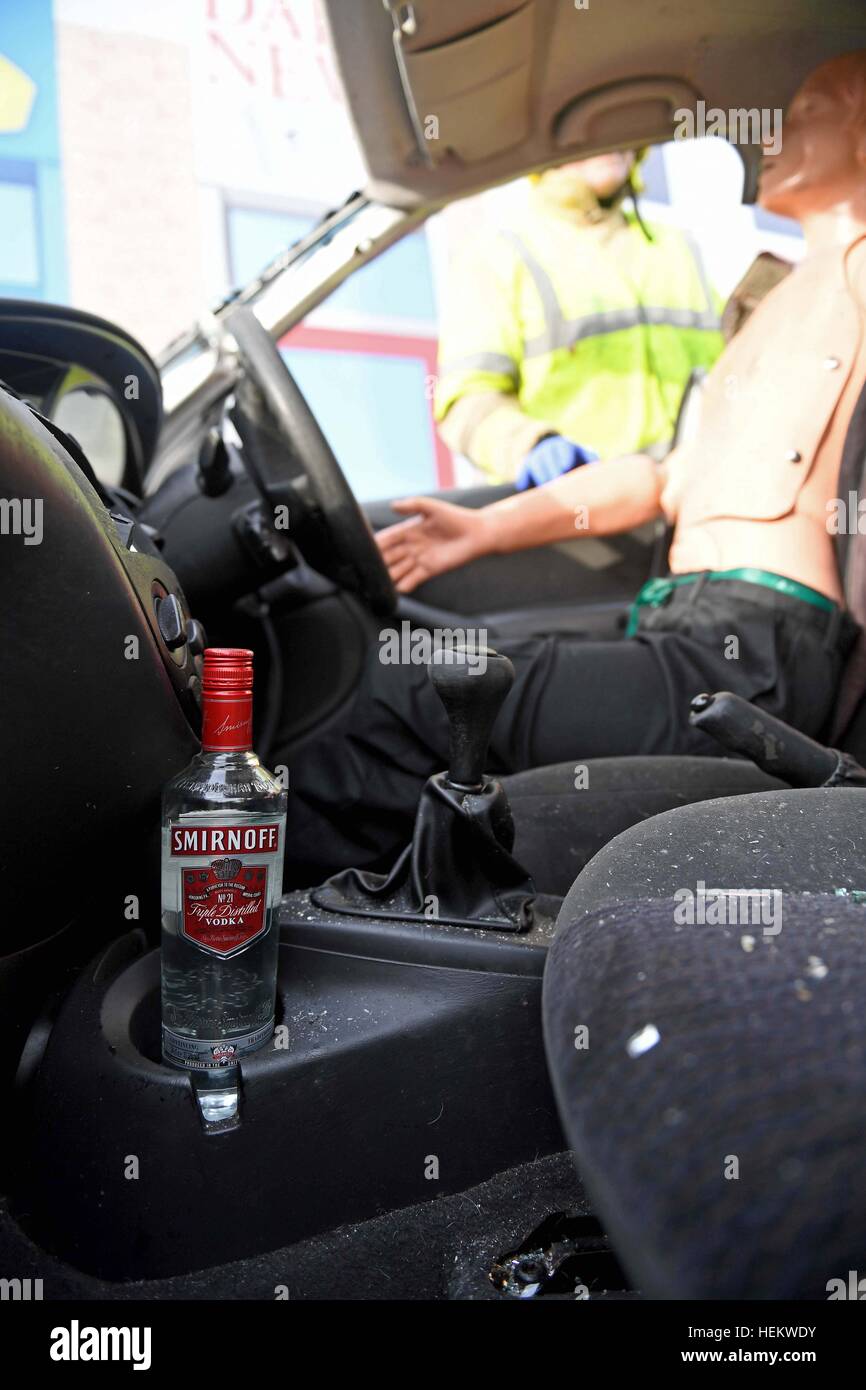 Bottle of alcohol in a car during a demonstration of an accident, UK ...