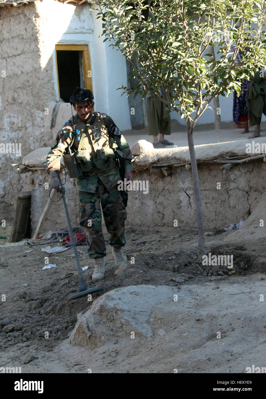 An Afghan National Army Commando scans the compound for improvised ...