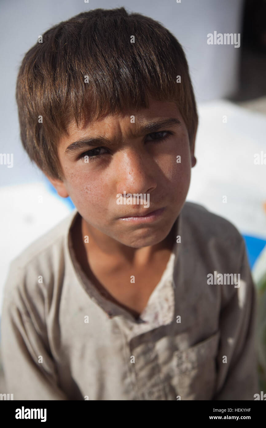 A young Afghan boy looks at the camera at the Women's Center at Forward ...