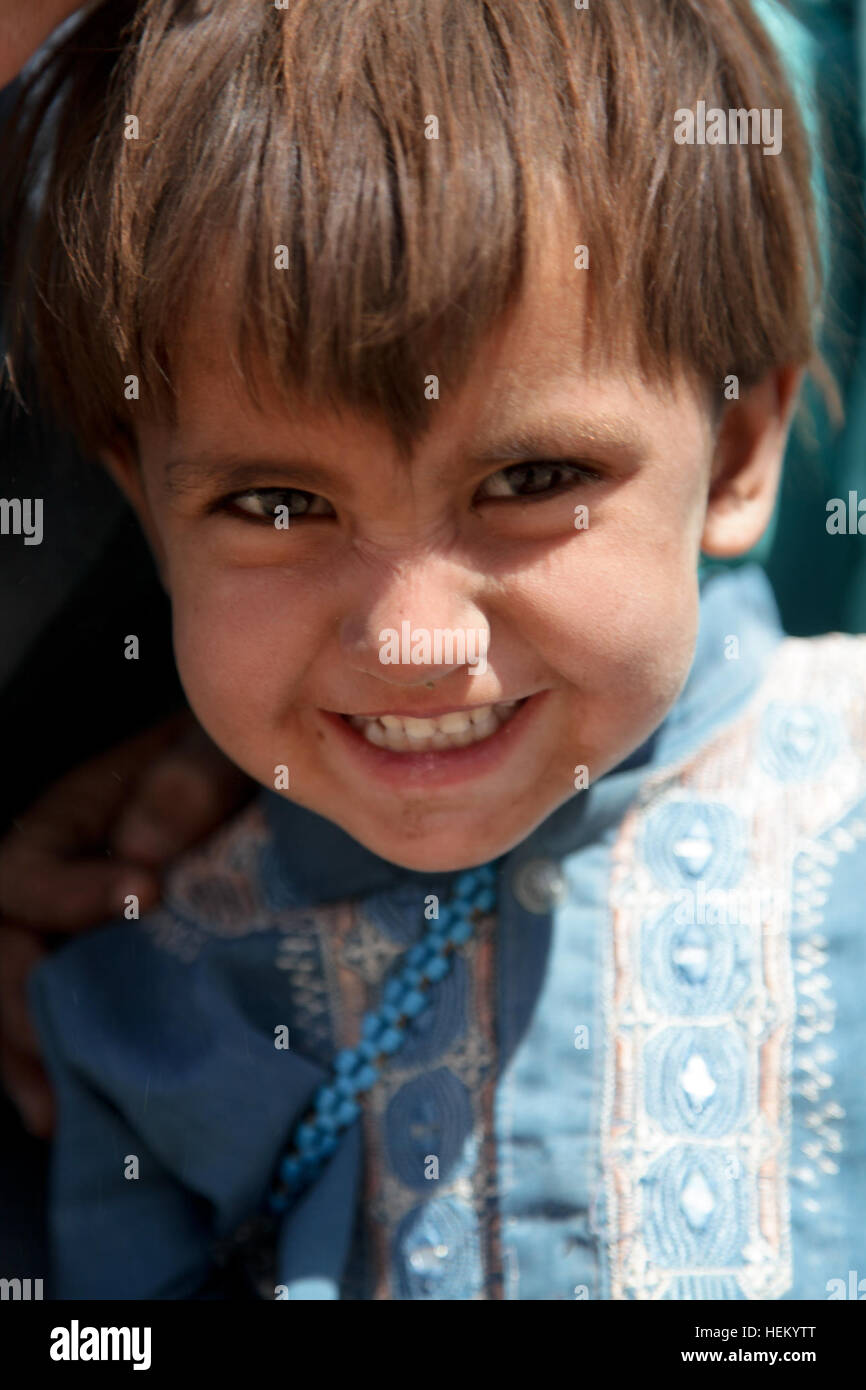 A local Afghan boy poses for the camera at the Dasht Camp, in Kandahar ...