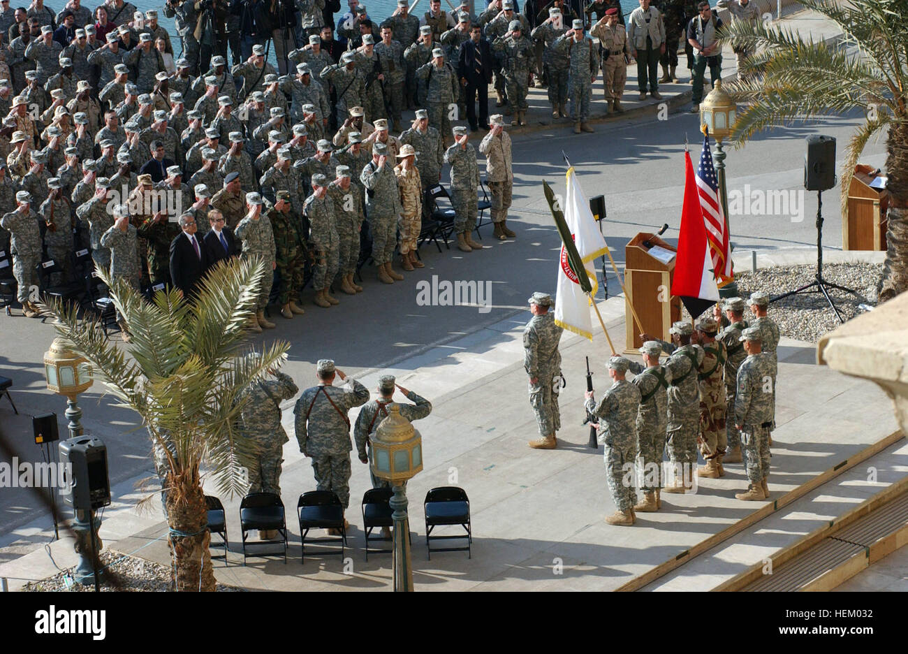 Servicemembers of Multi-National Corps-Iraq salute during the playing ...