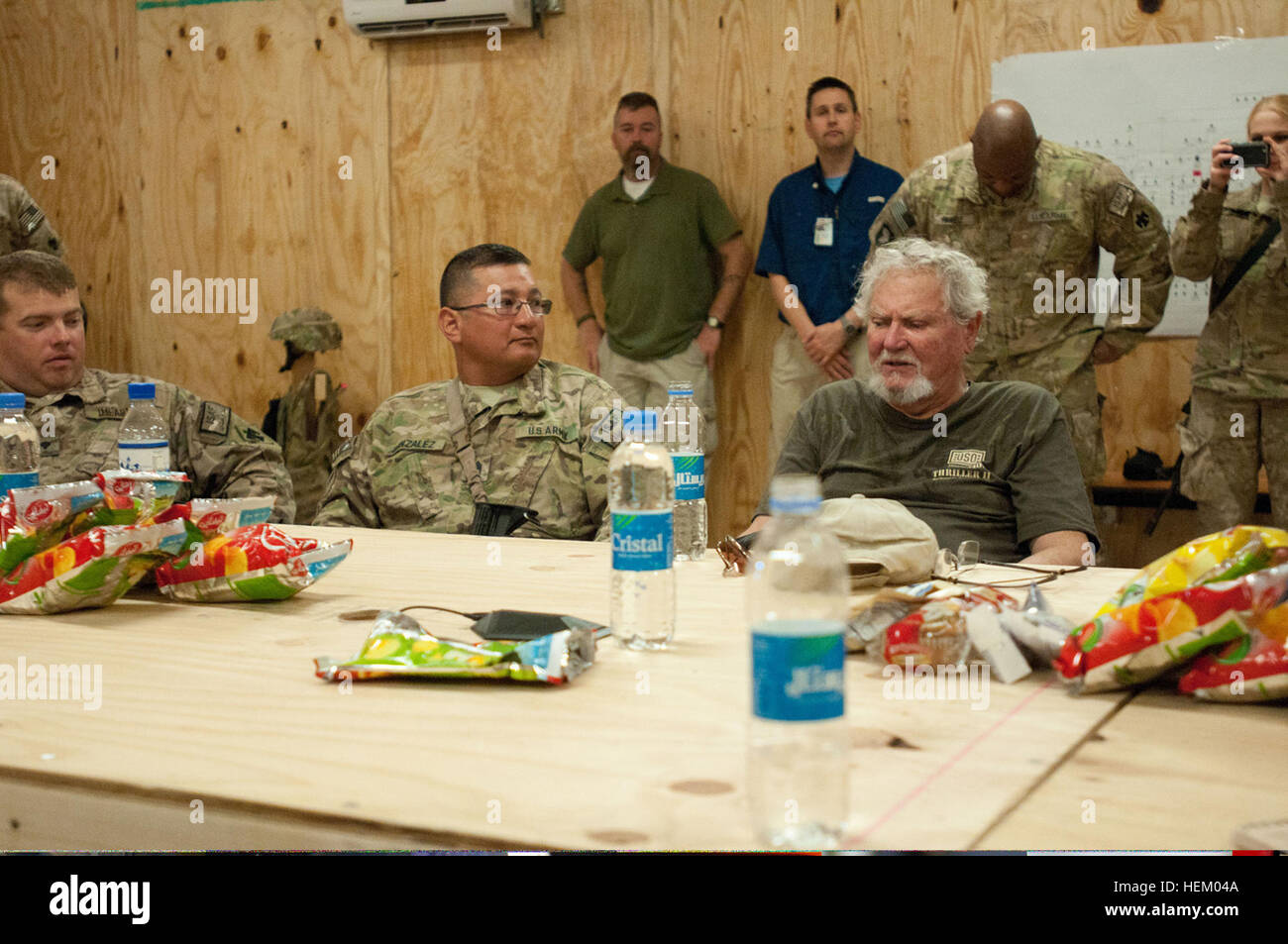 Thriller author Clive Cussler, foreground right, speaks with U.S ...