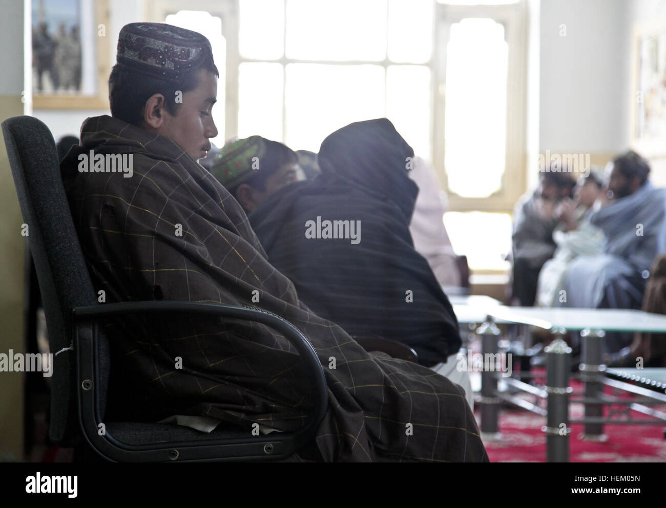 Afghan men attend an Afghan Local Police verification shura at Forward ...
