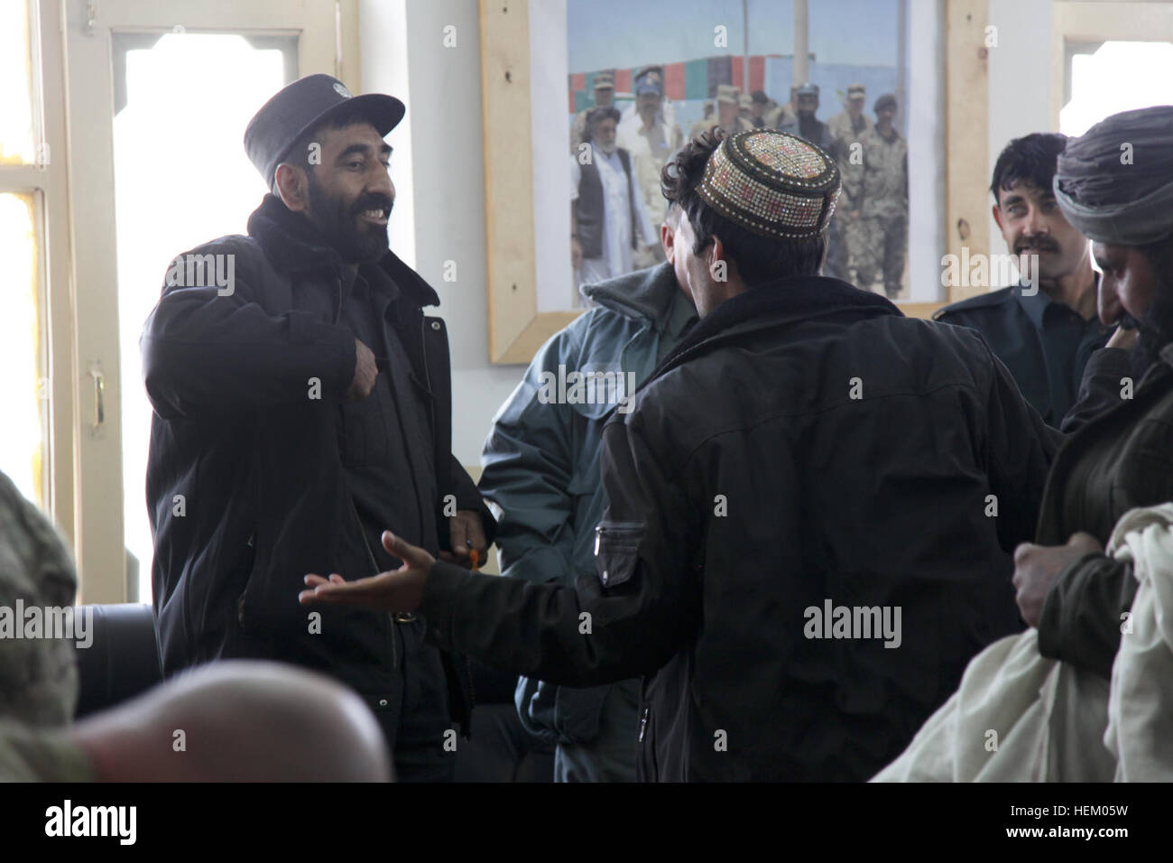 Masom Khan (left), Zhari district chief of police, talks with Afghan ...