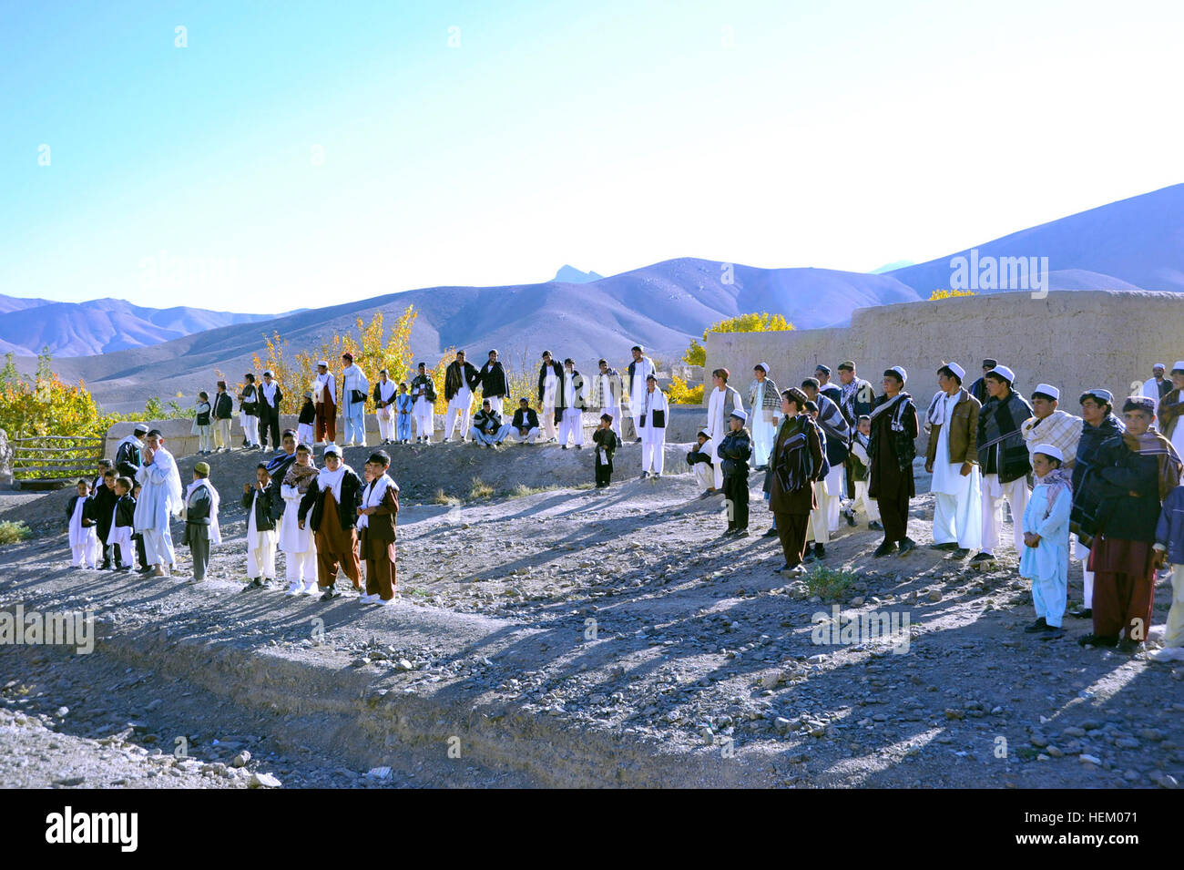 WARDAK PROVINCE, Afghanistan – Young men and boys gather to receive ...