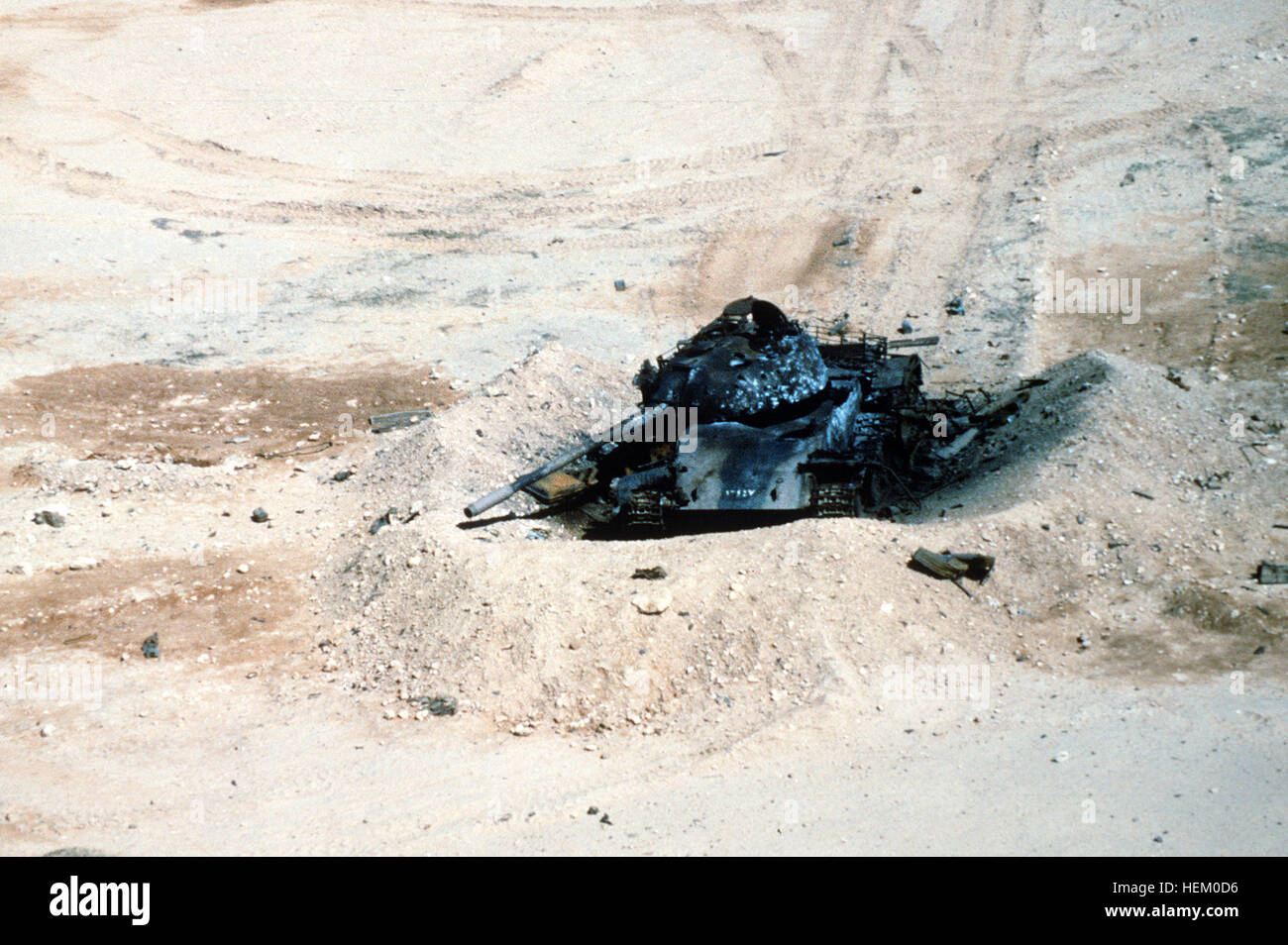 An Iraqi T-55 tank lies in ruins in the aftermath of an Allied bombing ...