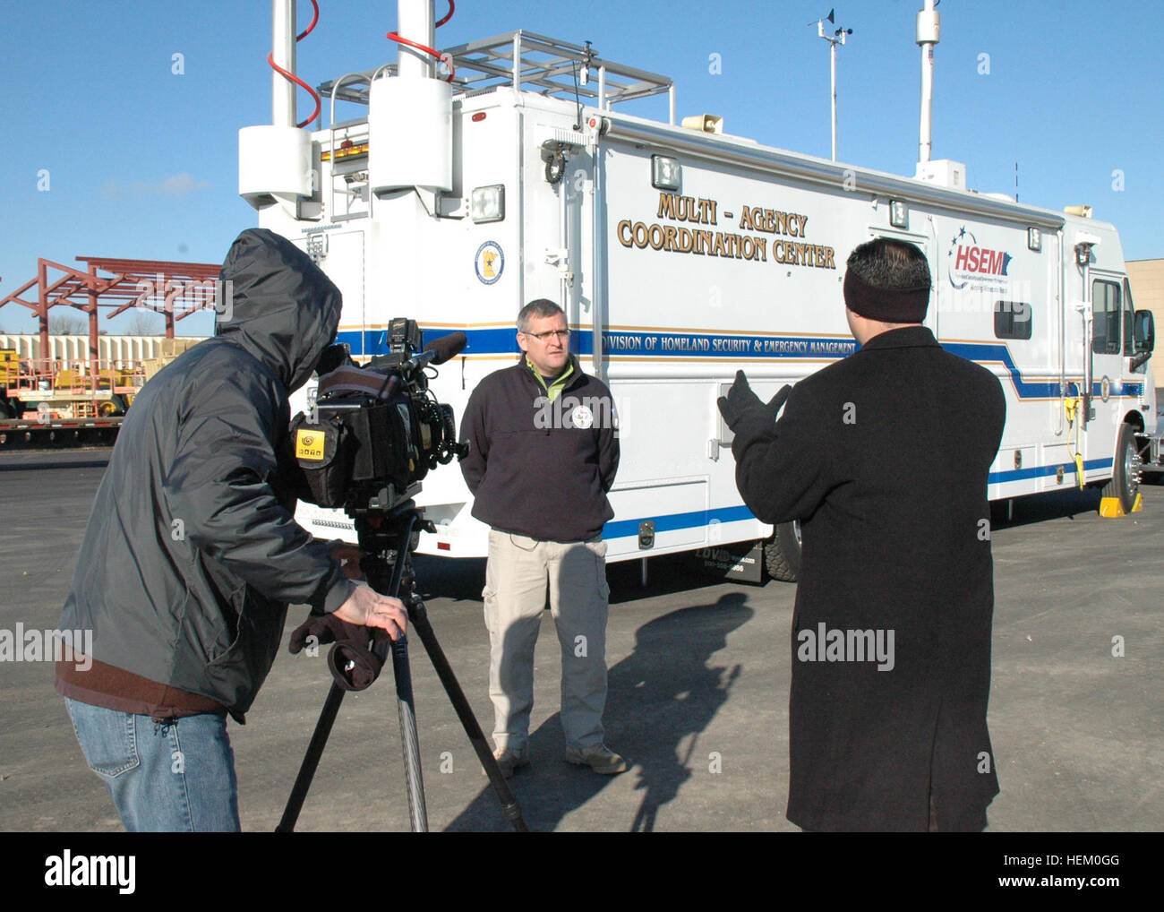 Kevin Reed, Emergency Management Team, is interviewed by a television ...