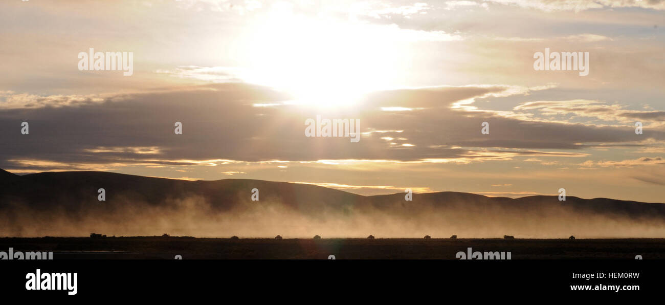 A convoy of 37th Infantry Brigade Combat Team vehicles travels through ...