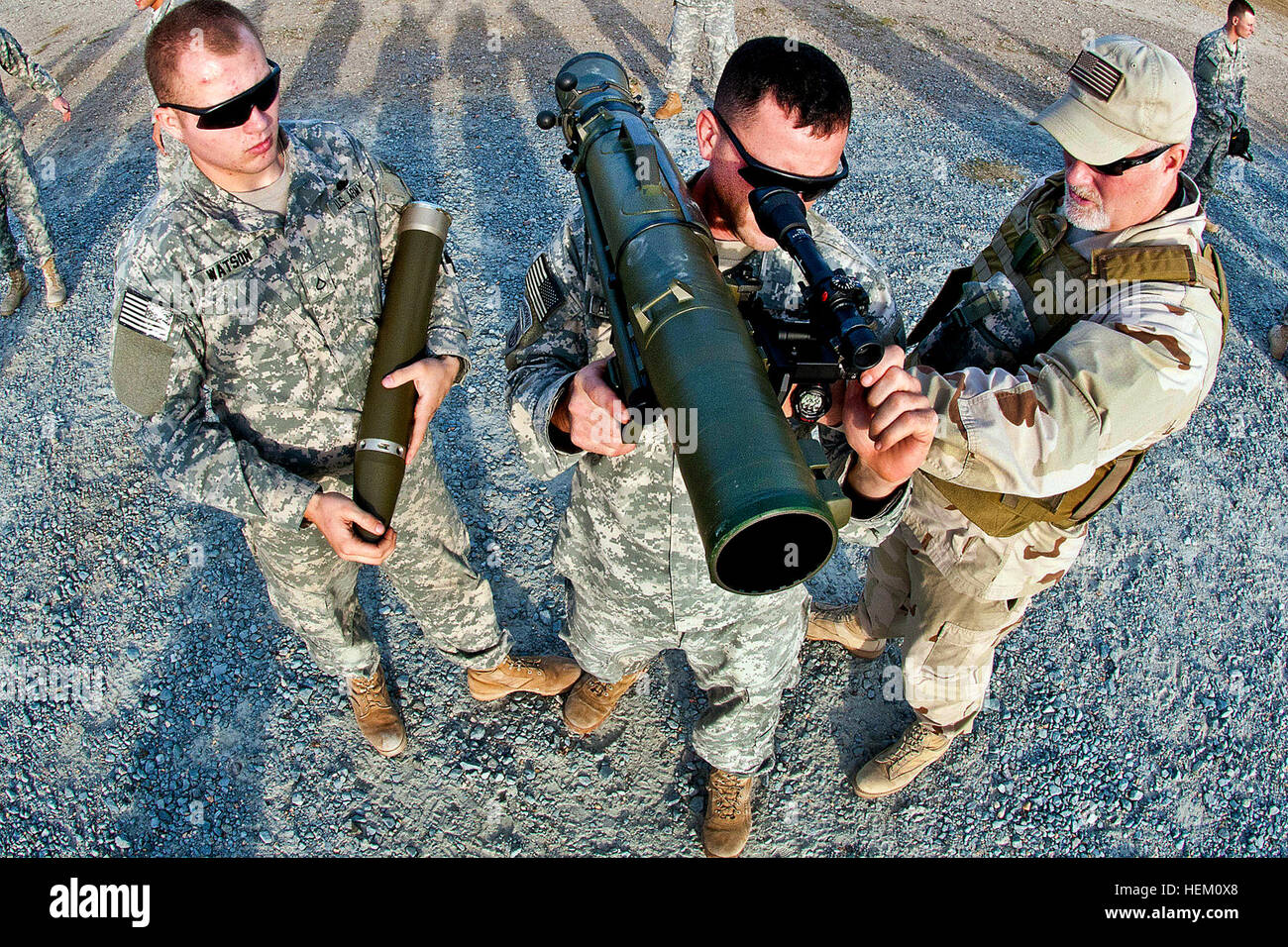 A civilian instructor coaches two paratroopers with the 82nd Airborne ...
