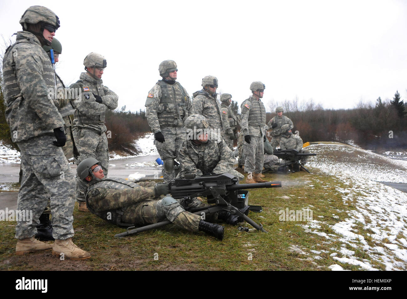 Soldiers from Hawk Company, 3rd Squadron, 2nd Cavalry Regiment watch a ...