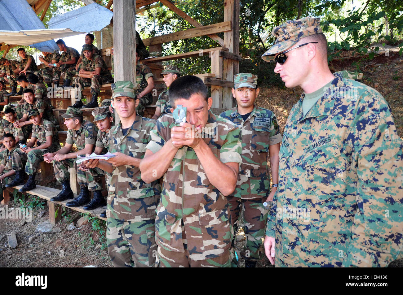 U.S. Marine Corps Sgt. Mark Miller, right, assigned to the Marine Corps ...