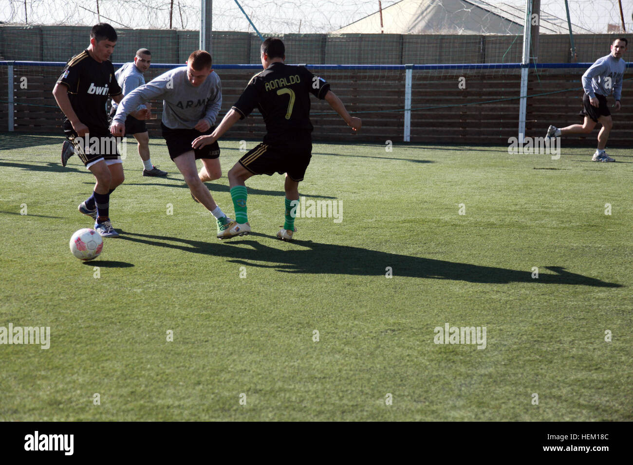 A soldier, attached to Task Force One Panther, dribbles thru two Afghan ...